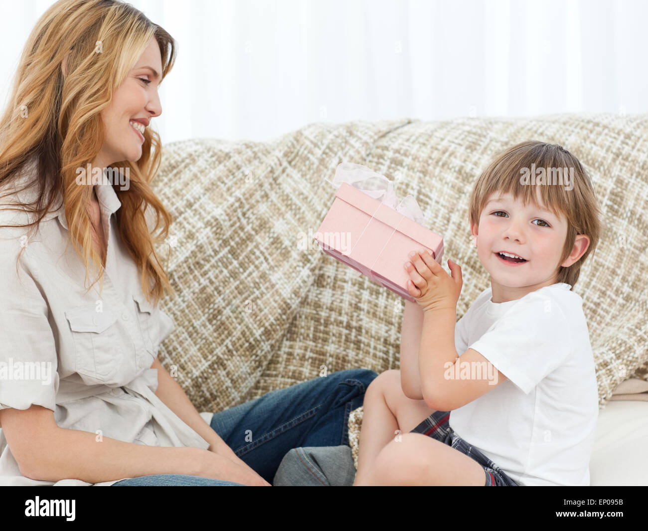 Happy children with his gift Stock Photo - Alamy