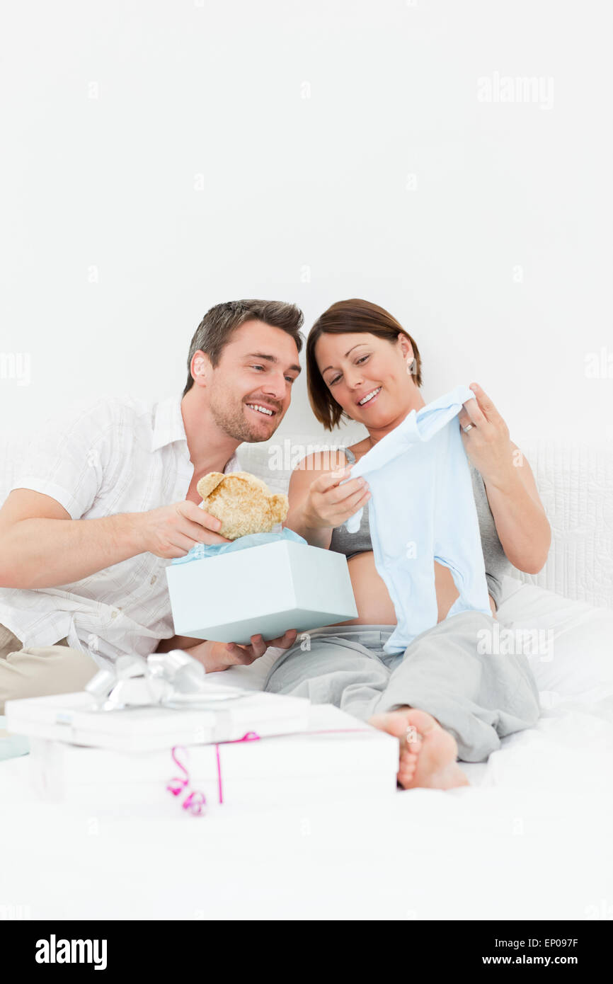 Woman offering a gift to her wife Stock Photo - Alamy