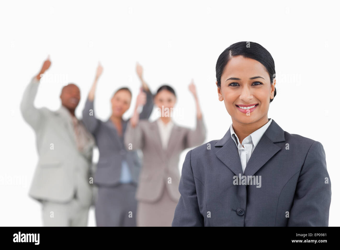 Smiling tradeswoman with cheering team behind her Stock Photo - Alamy