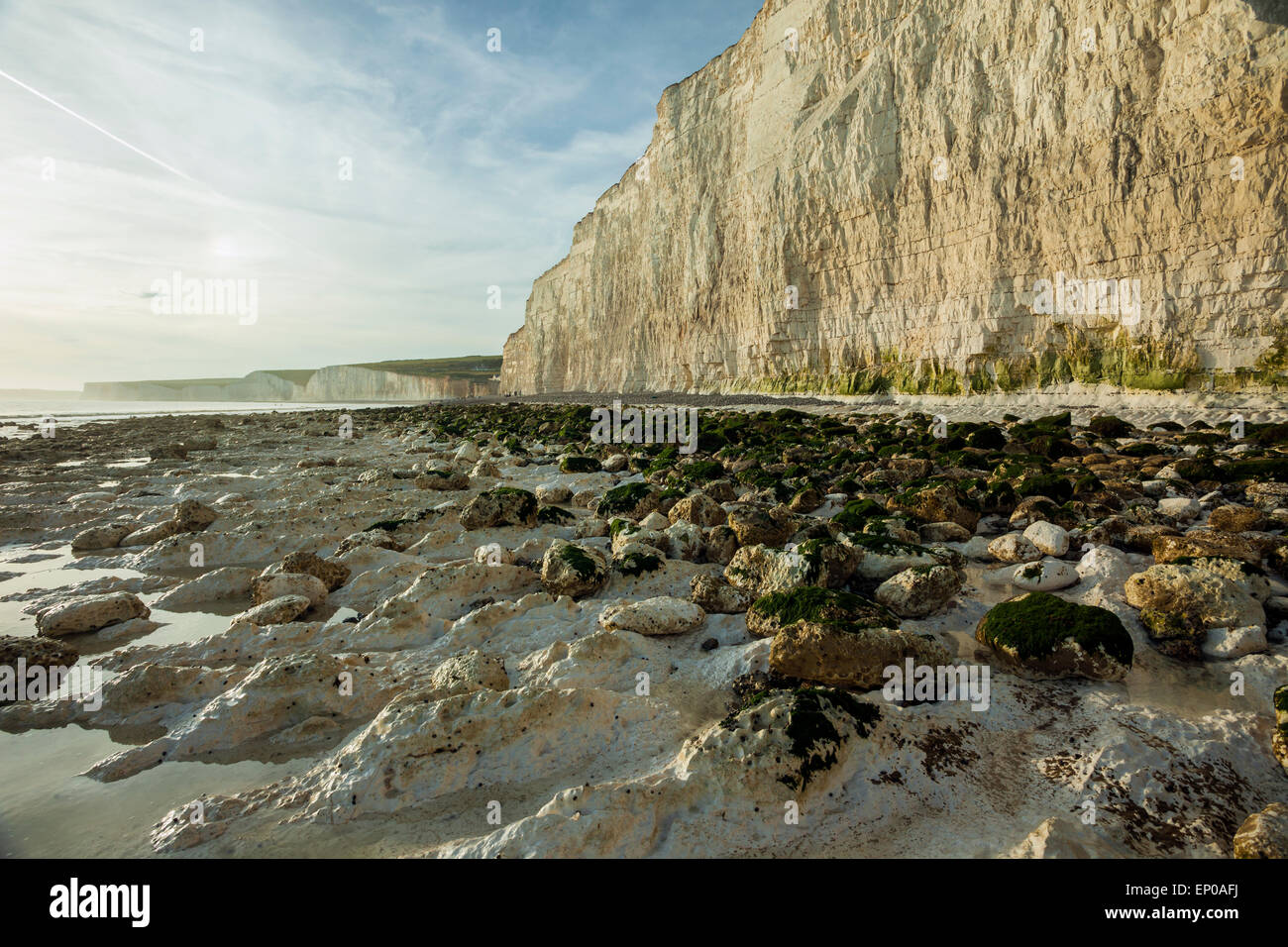 White cliffs of Beachy Head, Sussex, England. Seven Sisters looming in ...