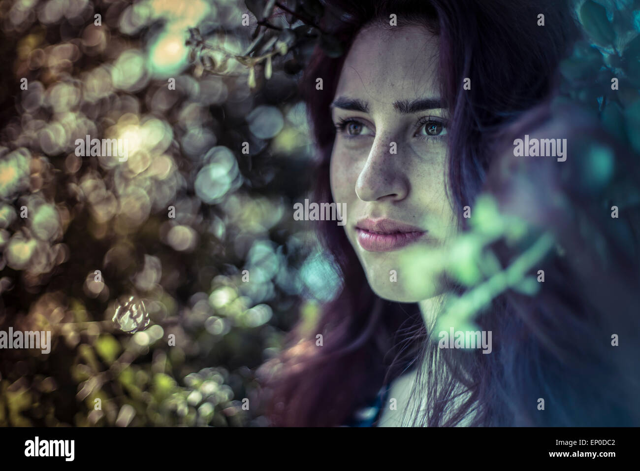 Feeling blue, melancholy young girl in a forest with sad gesture Stock ...
