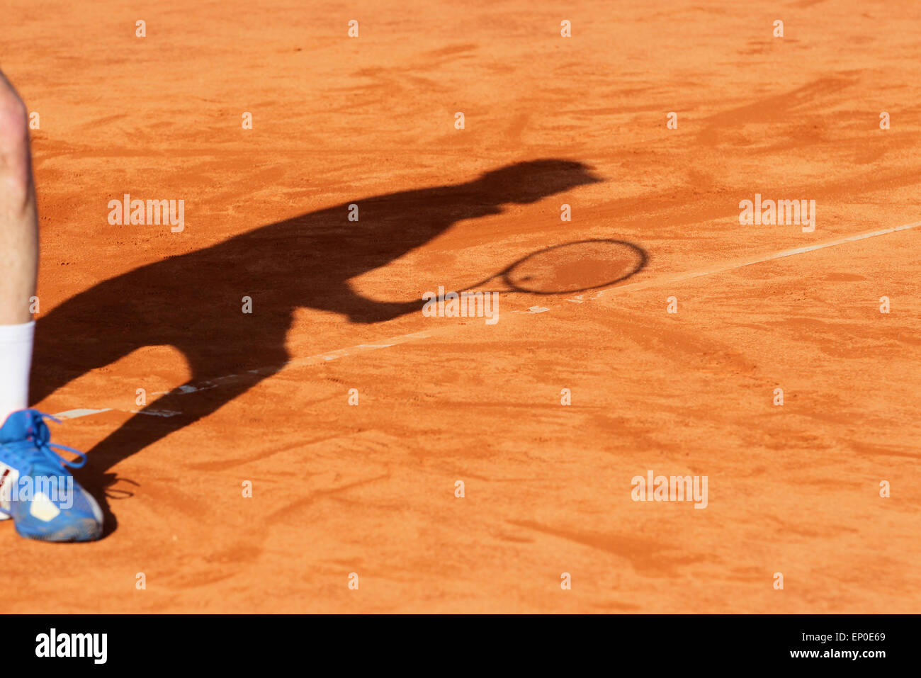 Shadow of a tennis player Stock Photo - Alamy