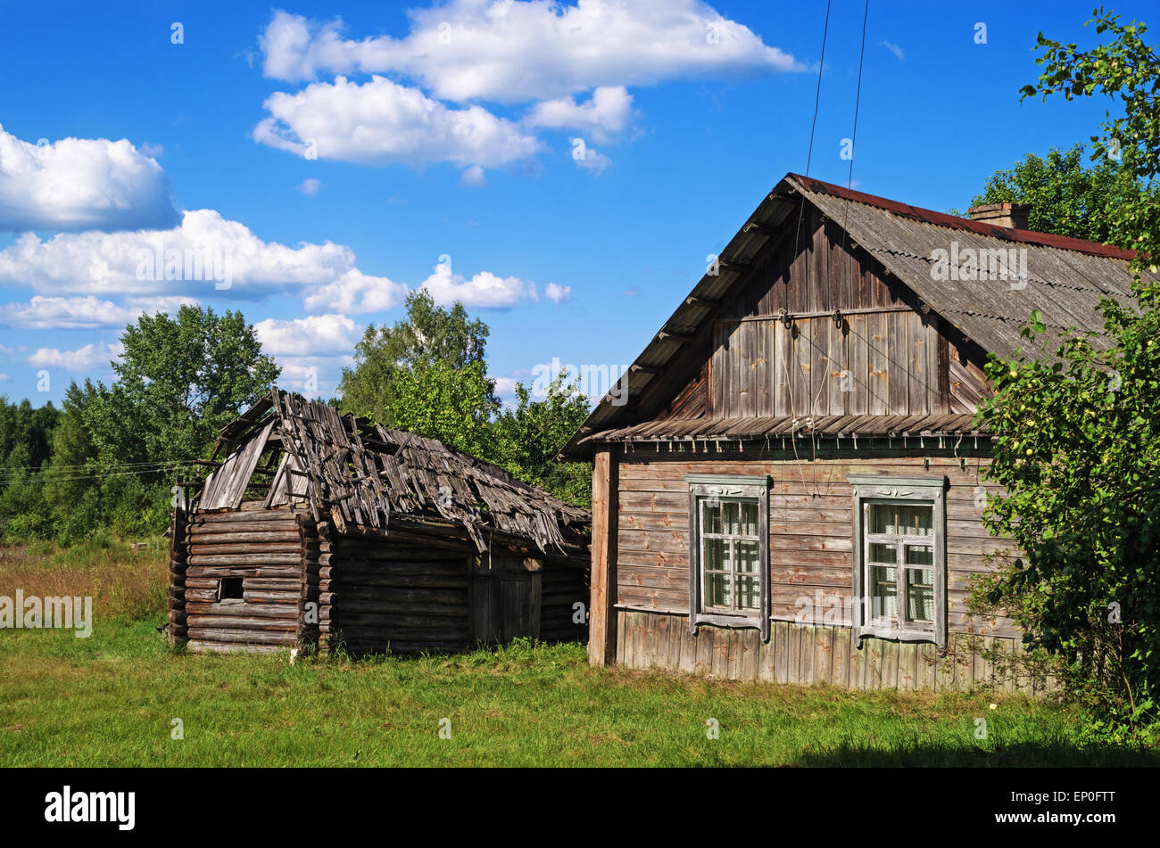 Village landscape - old wooden house and shed Stock Photo - Alamy