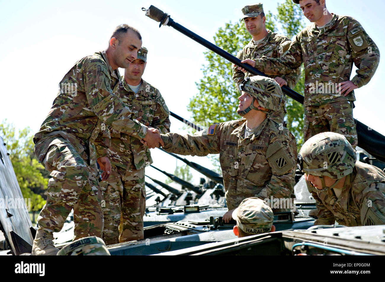 A Georgian soldier greets U.S. Army soldiers from the 3rd Infantry ...