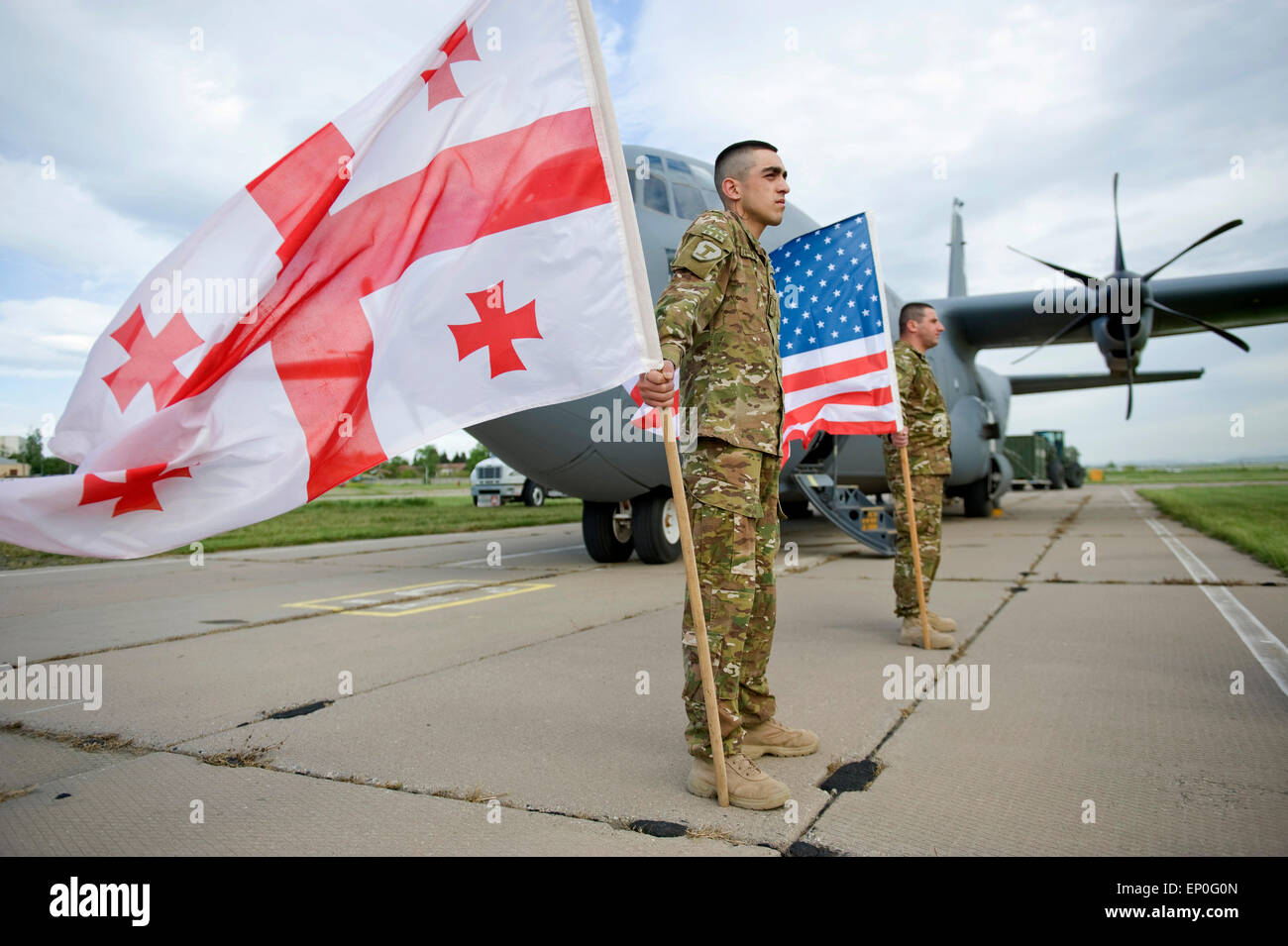 Georgian soldiers wait to welcome paratroopers from the 91st Cavalry ...