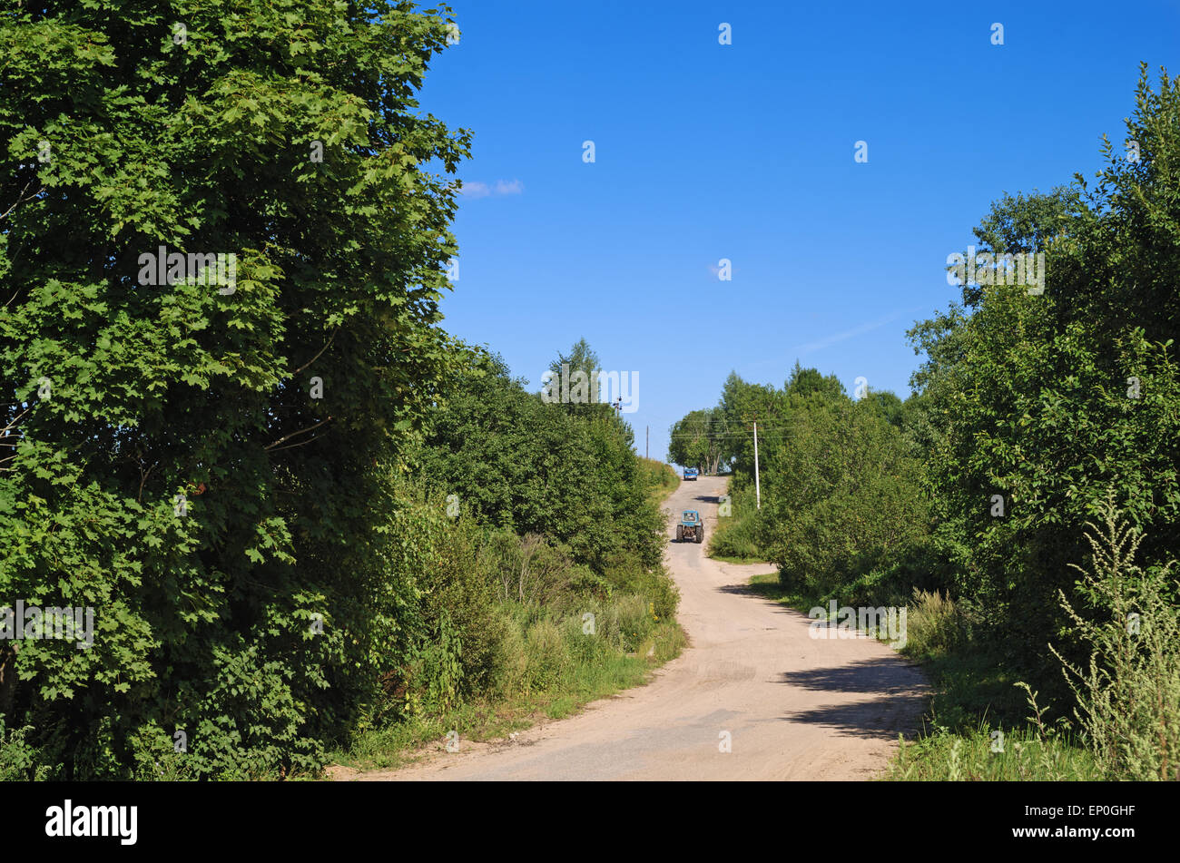 Village landscape - asphalt road through village Stock Photo - Alamy