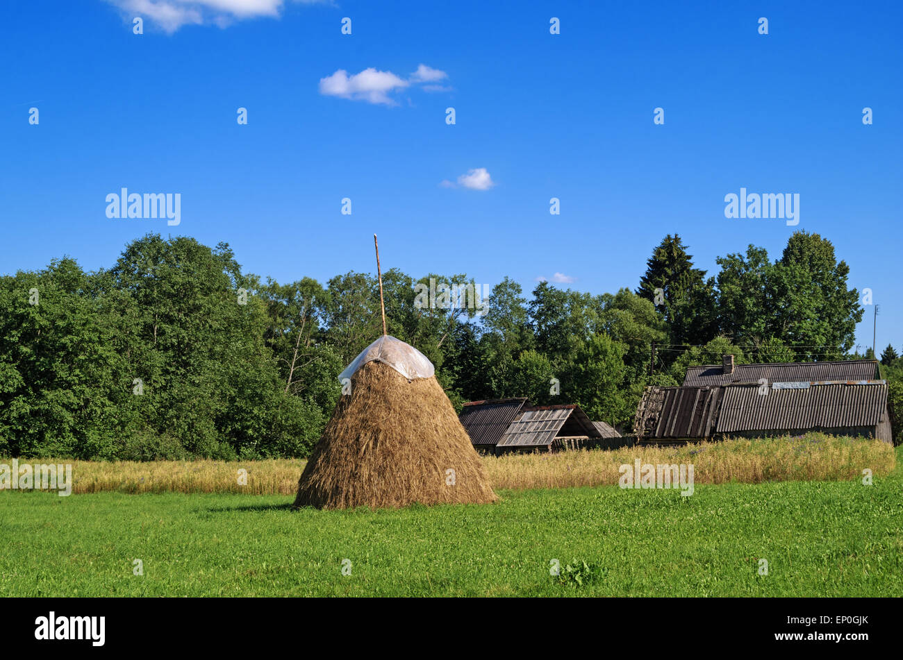 Village landscape with hay stack Stock Photo - Alamy