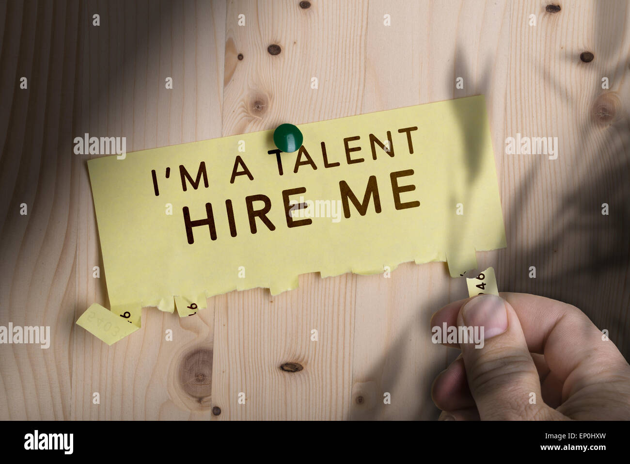 The text hire me pinned to wooden notice board. Concept for summer job ...