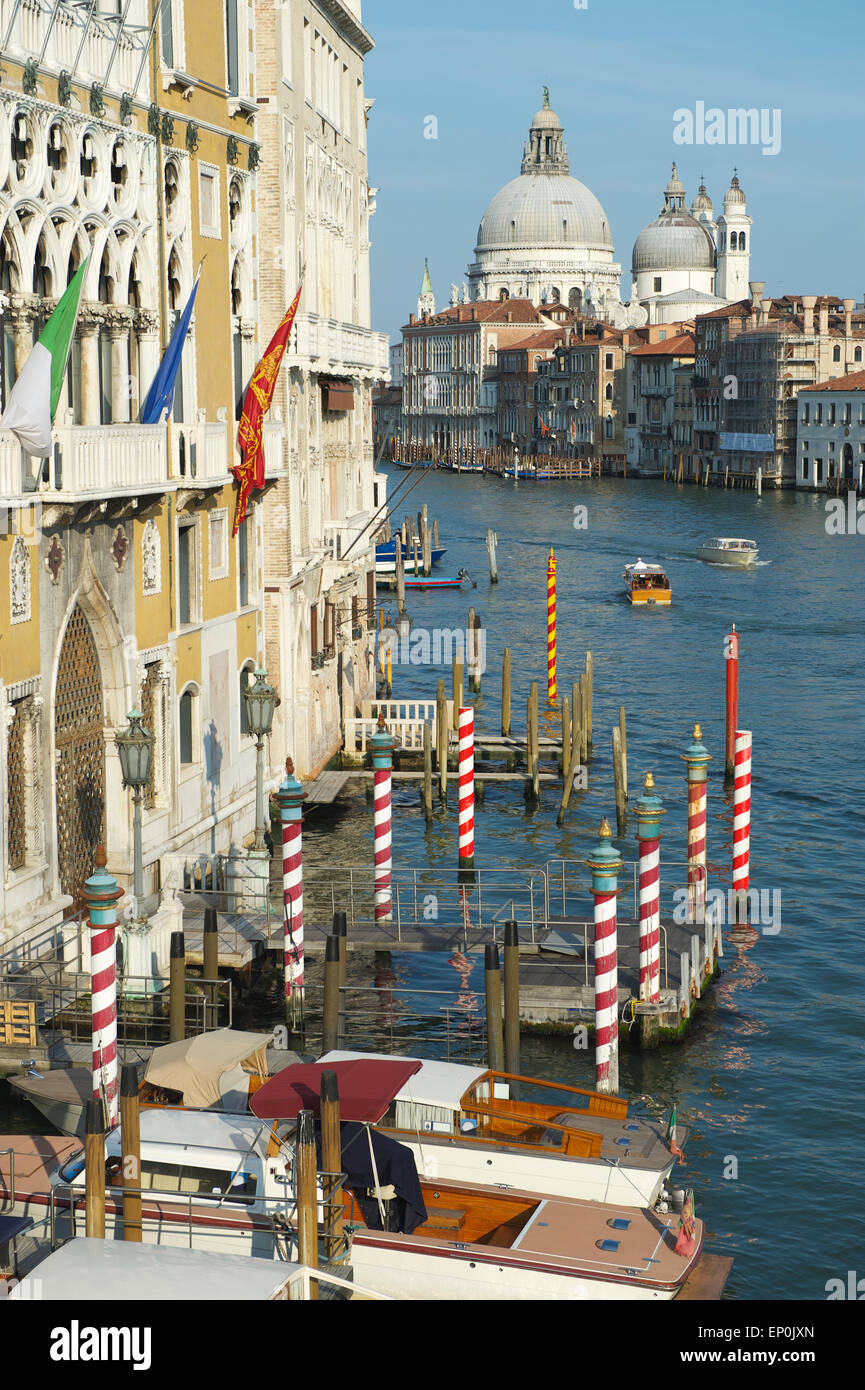 Scenic waterside view from the Ponte dell'Accademia of traditional red ...