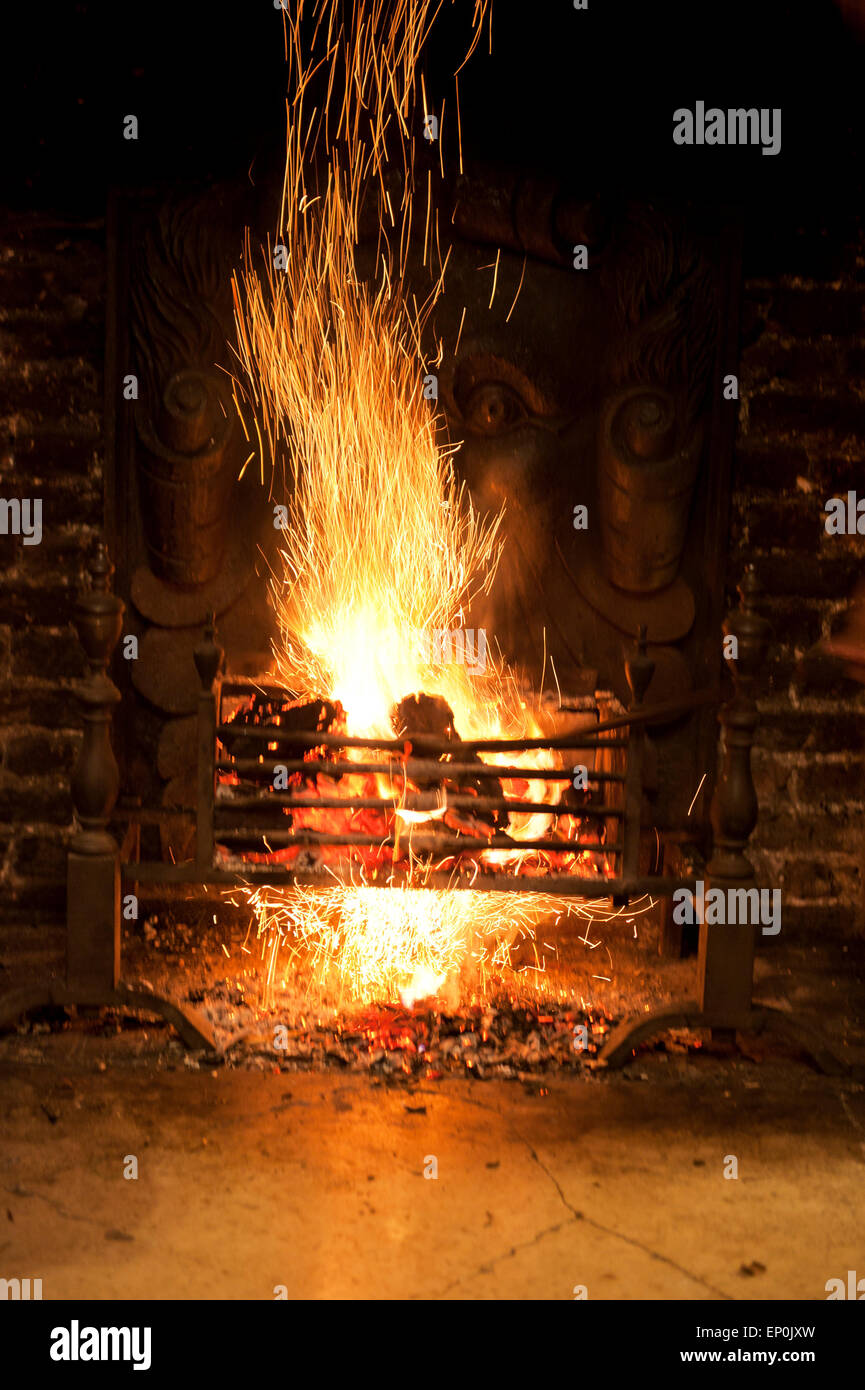 Open Fireplace with fire sparking Stock Photo - Alamy