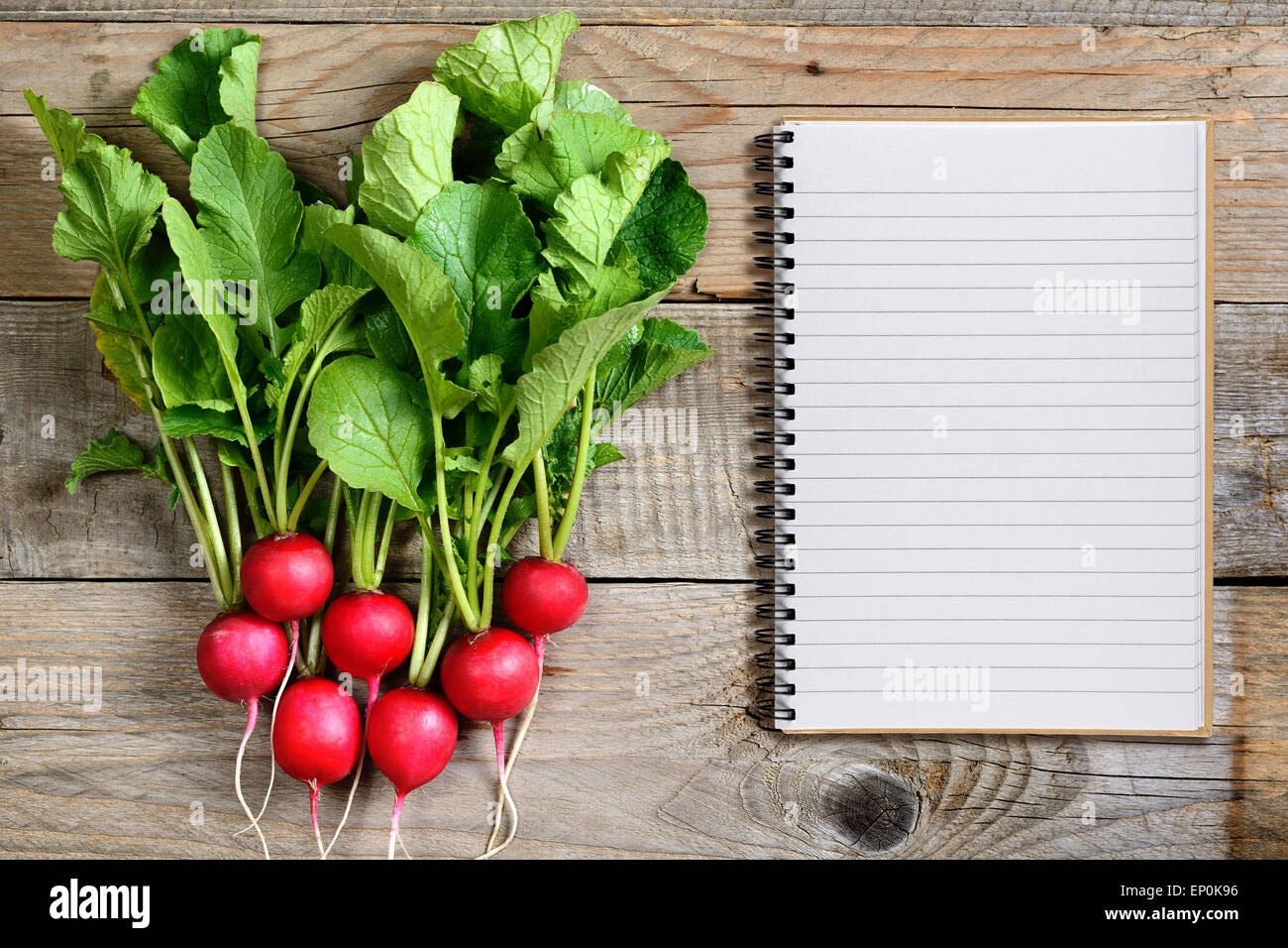 Fresh radish and recipe book on wooden background Stock Photo - Alamy