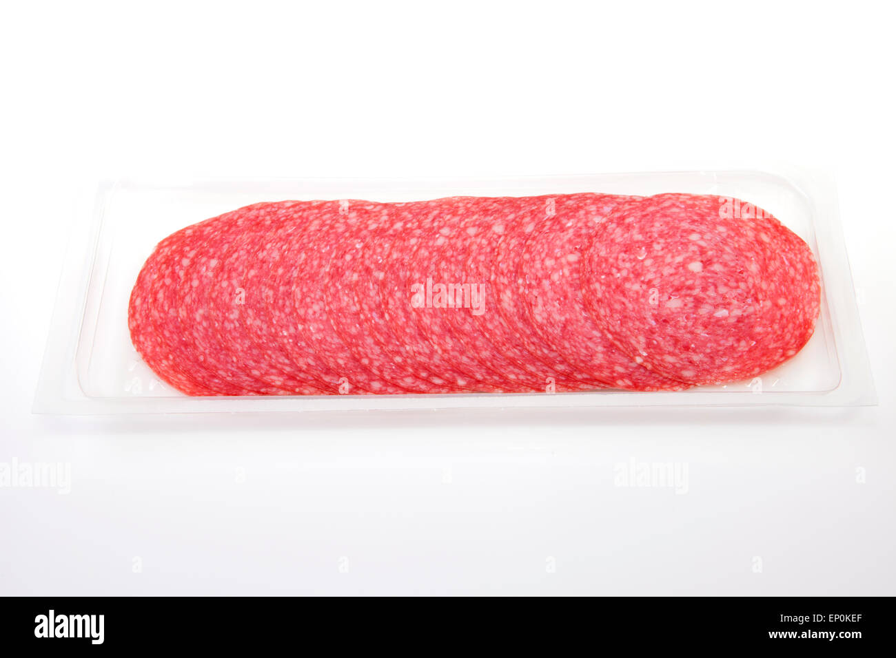 Sliced salami on the package. Isolated over white background Stock ...
