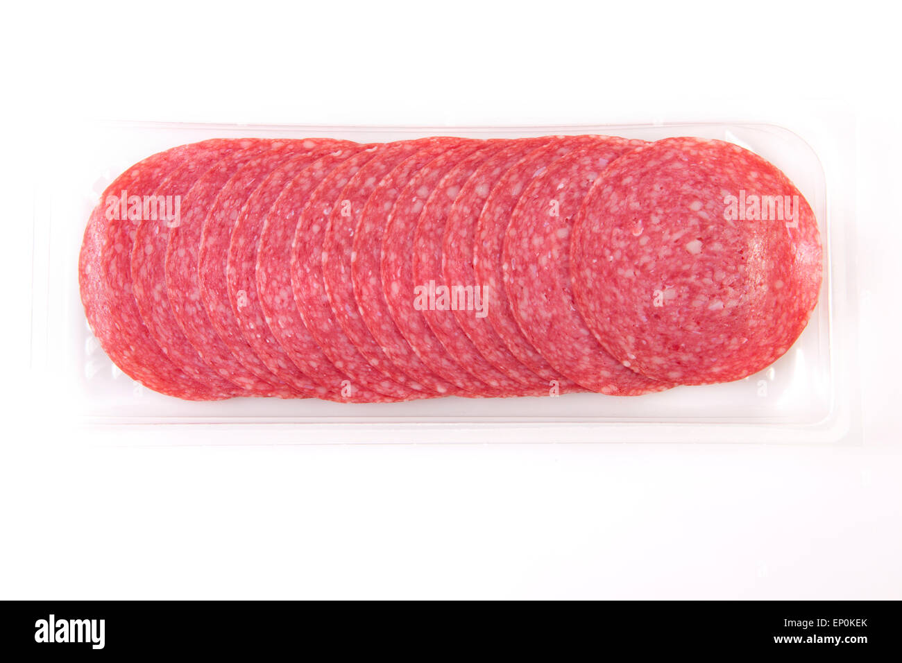 Sliced salami on the package. Isolated over white background Stock ...