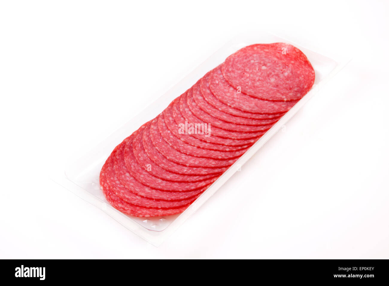 Sliced salami on the package. Isolated over white background Stock ...