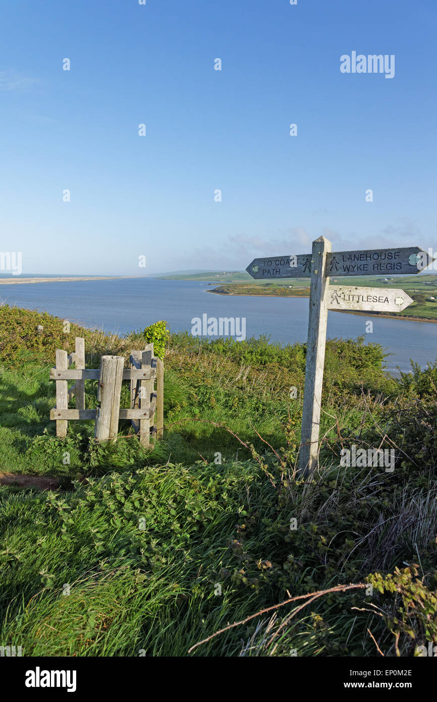 Fleet lagoon in spring time with signpost Stock Photo - Alamy