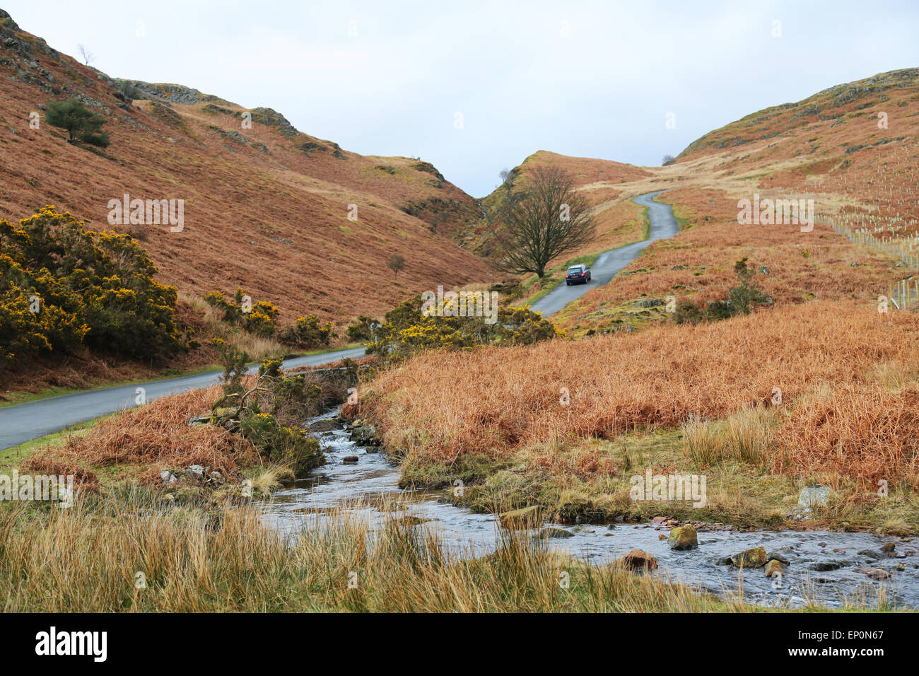 Car driving uphill in Lake District, UK Stock Photo - Alamy
