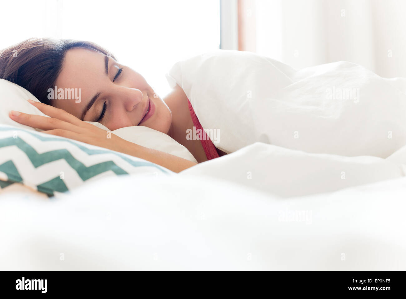 Woman relaxing in bed during the morning Stock Photo - Alamy