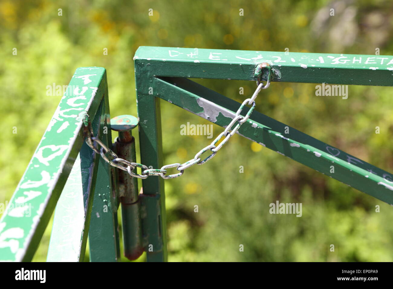 Metal gate with chain Stock Photo - Alamy