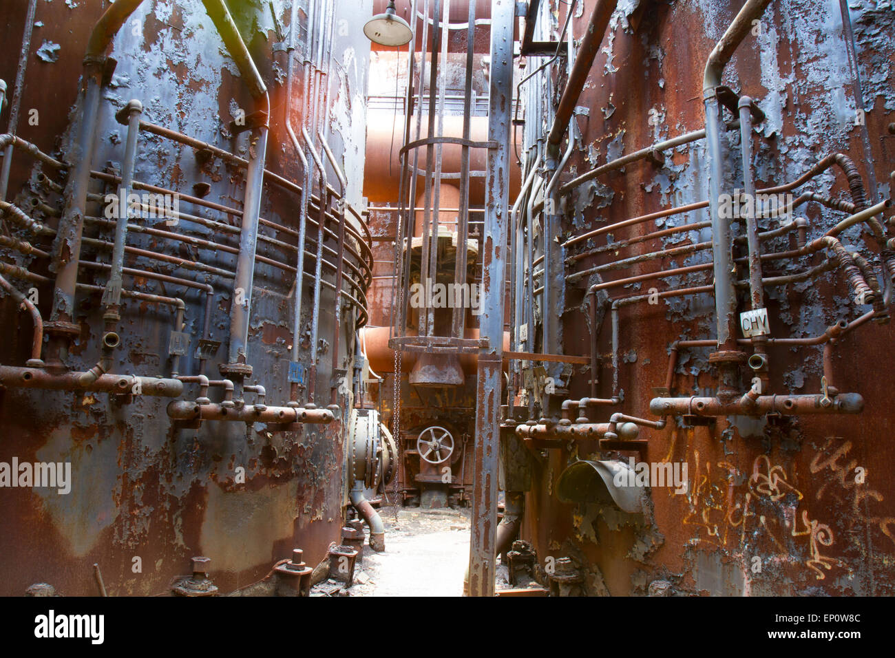 Interior of abandoned steel mill with rusting industrial vats Stock ...