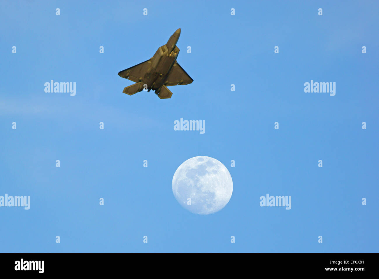 F-22 Raptor flying over the moon at 2015 Planes of Fame Air Show Stock ...