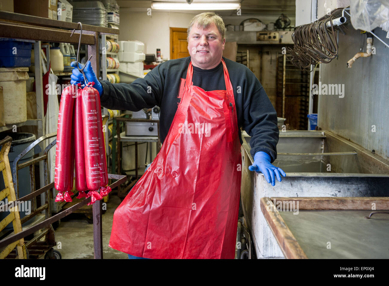 Man standing next to freshly made baloney Frostburg, Maryland Stock ...