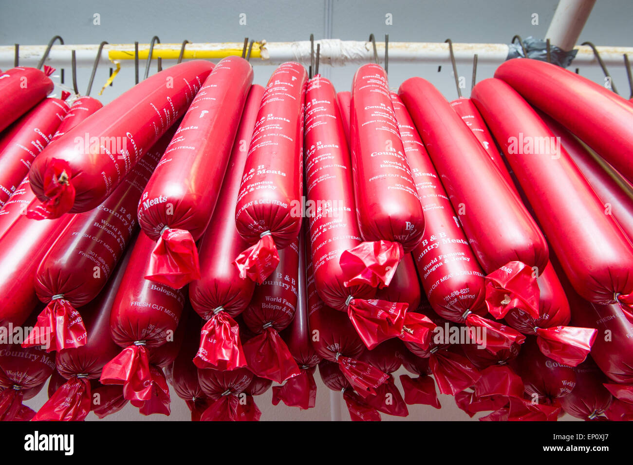 Tubes of baloney hanging from a pipe in Frostburg,MD Stock Photo - Alamy