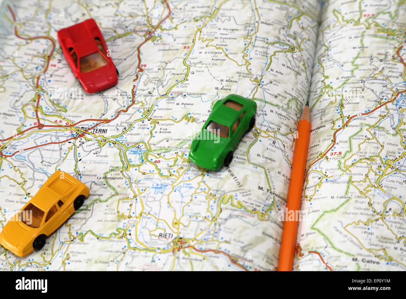 Cars on a road map Stock Photo - Alamy