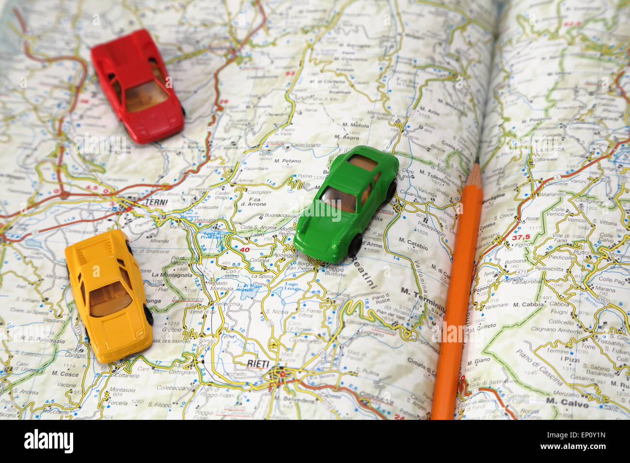 Cars on a road map Stock Photo - Alamy
