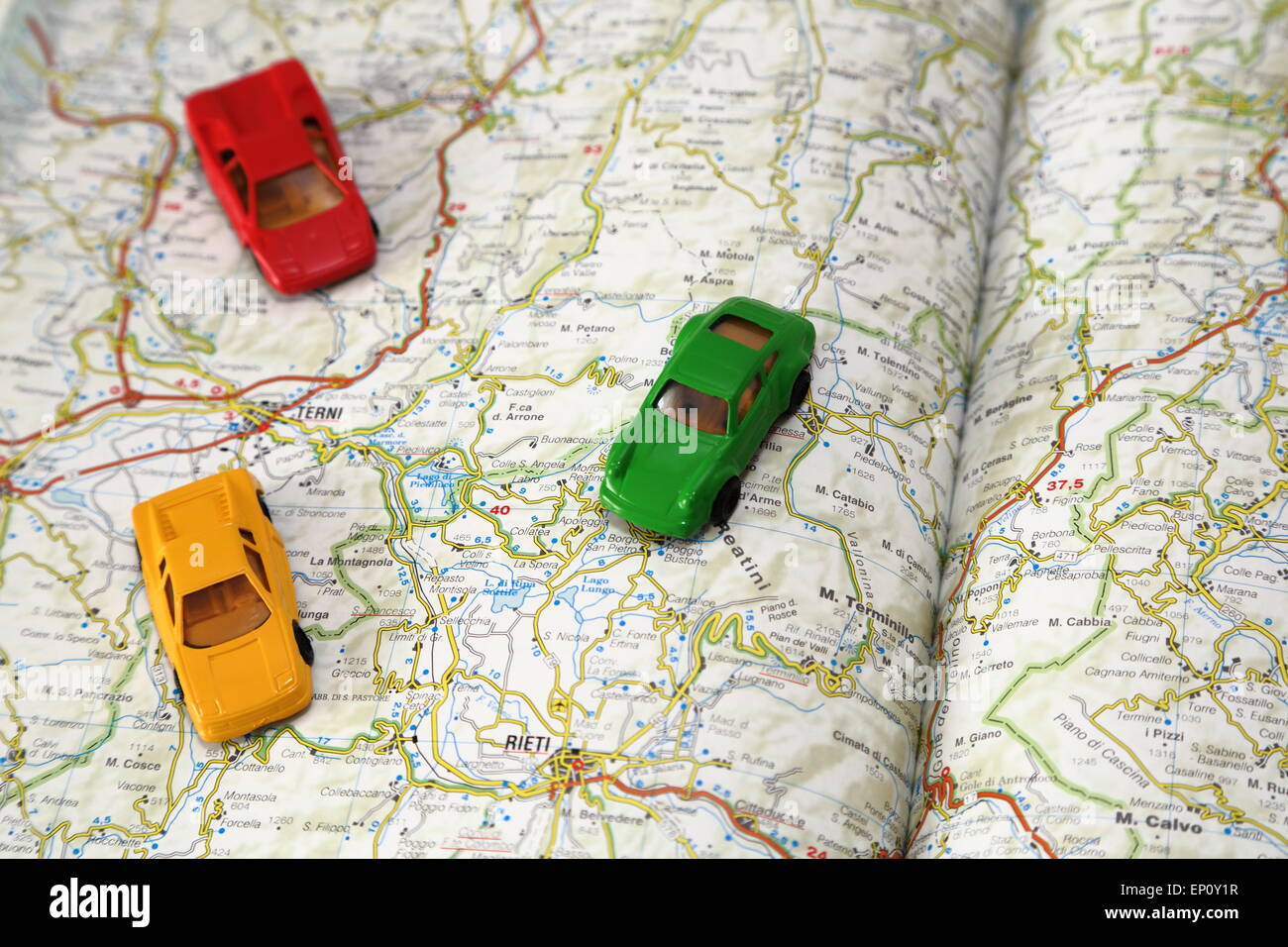 Cars on a road map Stock Photo - Alamy
