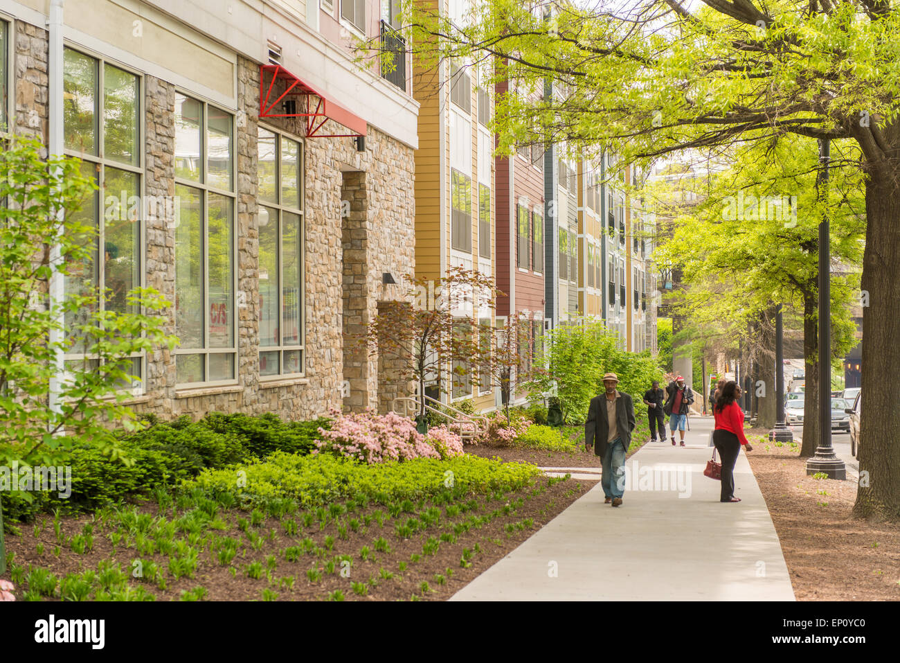 People walking down a sidewalk at Rhode Island Row in Washington DC ...
