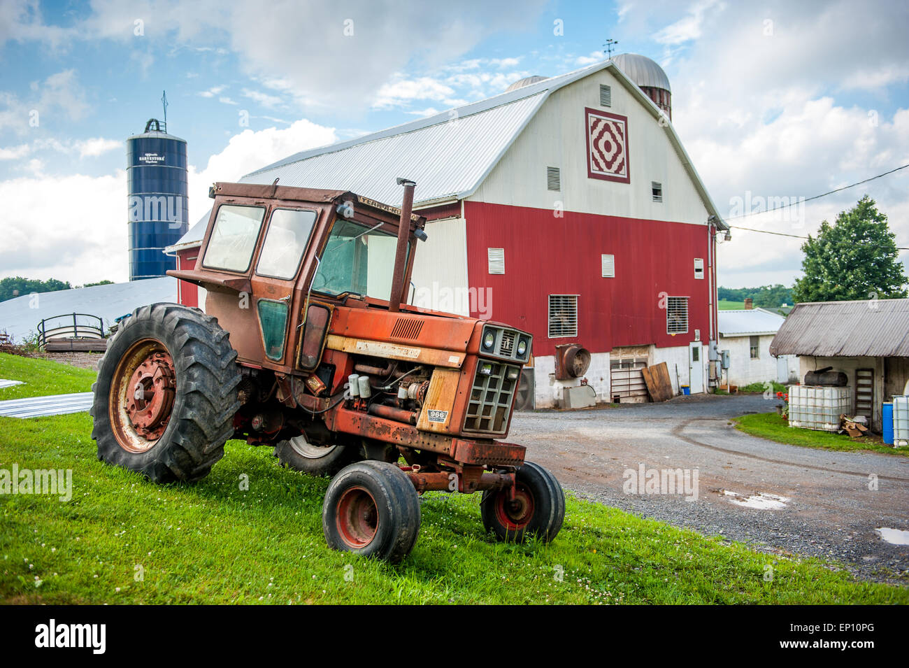 Vintage red tractor near red and white painted barn near Garrett County ...