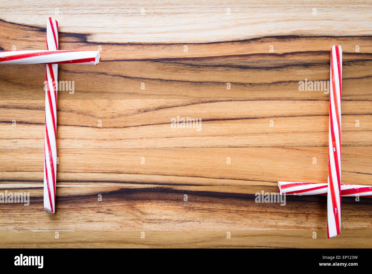 holiday background with stripped peppermint sticks on a wooden ...