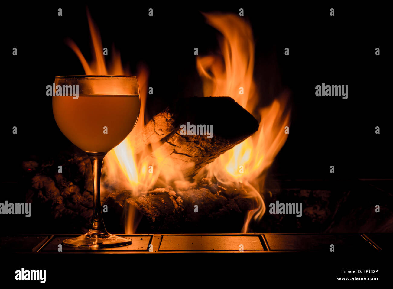 Wine glass by fire for winery adventure background image Stock Photo ...