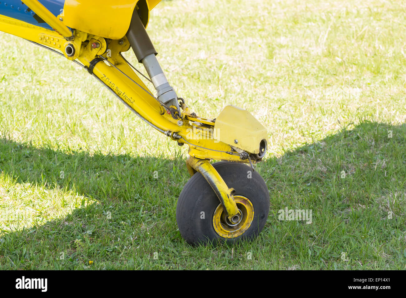 Detail view of a light aircraft rear landing gear arm and tire Stock ...