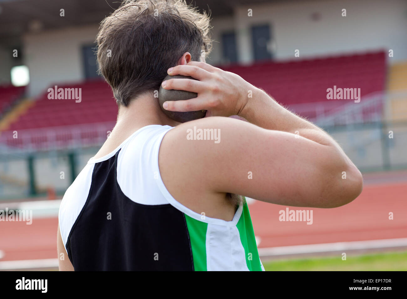 Concentrated male athlete preparing to throw weight Stock Photo - Alamy
