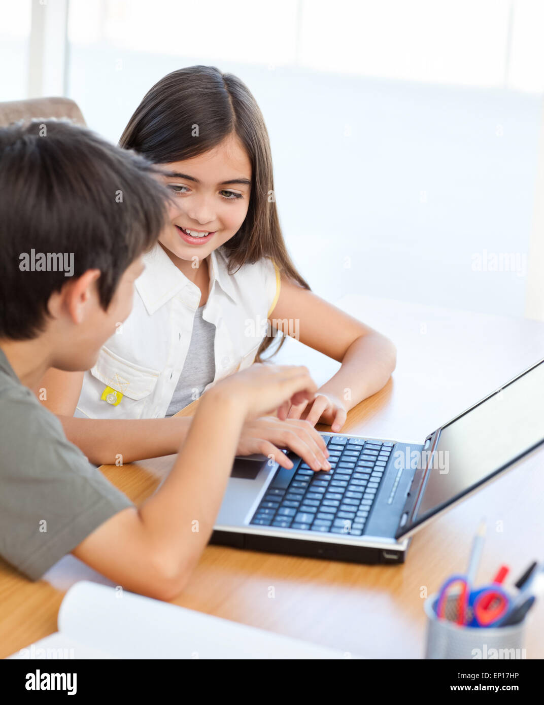 Children working on their laptop at home Stock Photo - Alamy