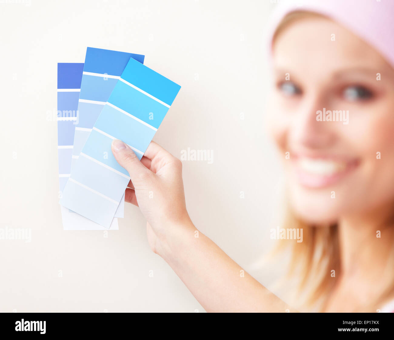 Attractive young woman choosing color for painting a room Stock Photo ...