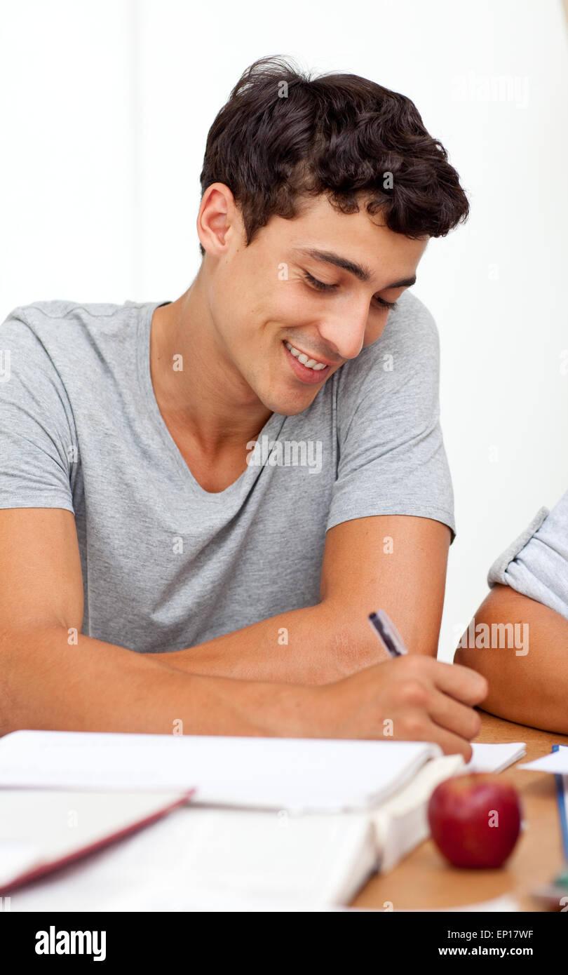 Portrait of a teen guy studying in the library Stock Photo - Alamy