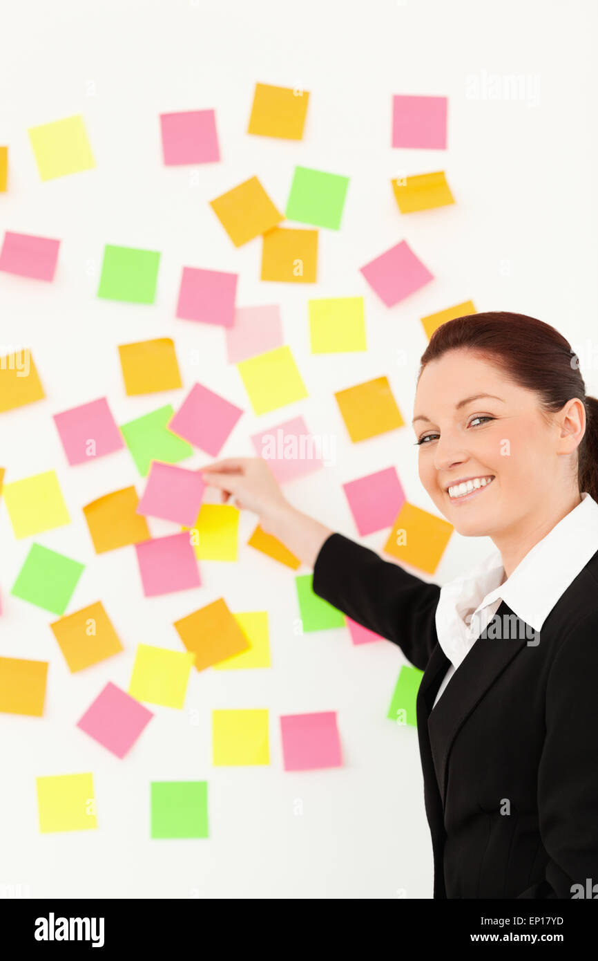 Woman putting sticky notes on hi-res stock photography and images - Alamy