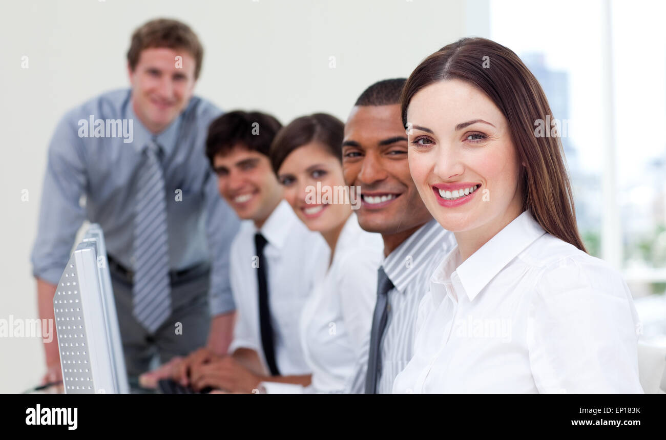 Cheerful business team working at computer Stock Photo - Alamy