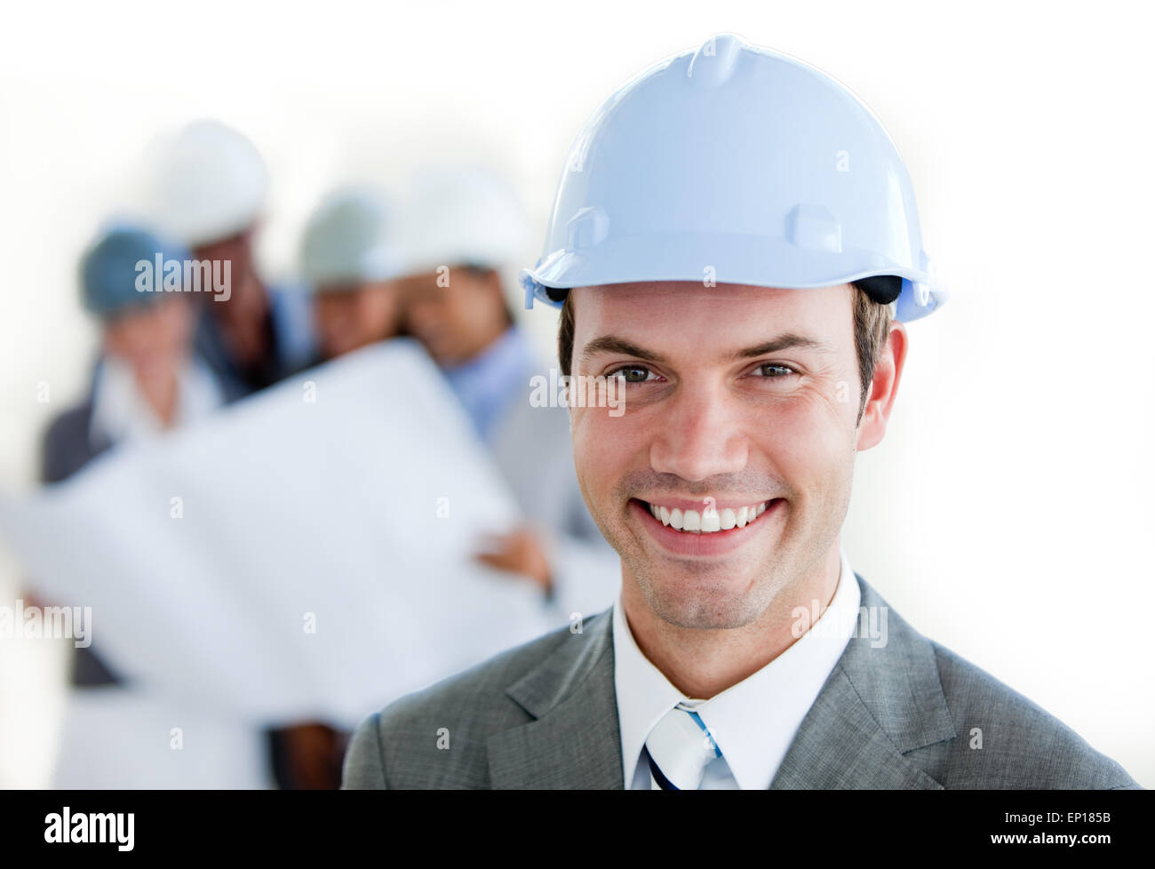 Smiling arhitect with a hardhat Stock Photo - Alamy
