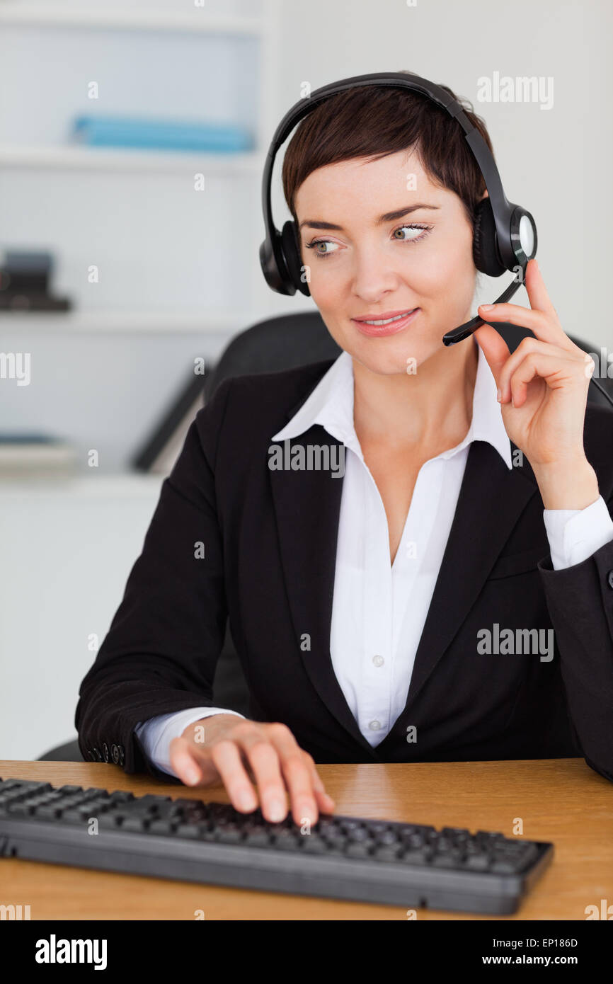 Portrait of a professional secretary calling with a headset Stock Photo ...