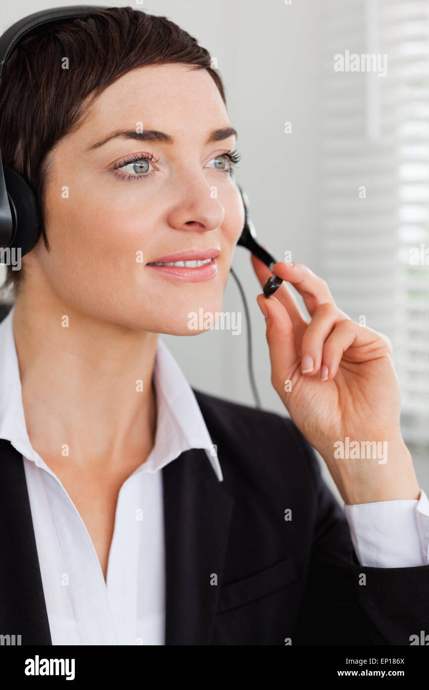 Portrait of a serious secretary with a headset Stock Photo - Alamy