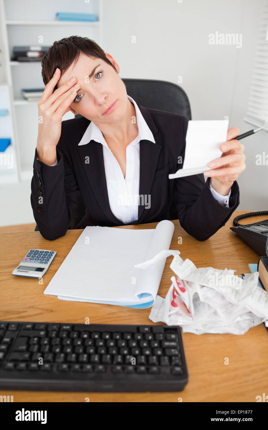 Portrait of a female accountant checking receipts Stock Photo - Alamy