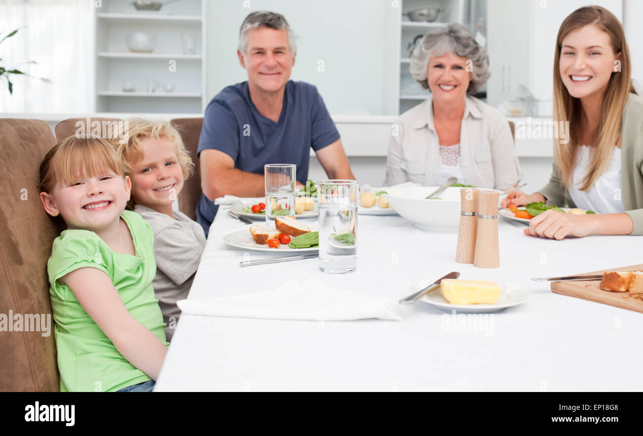 Pretty family looking at the camera Stock Photo - Alamy