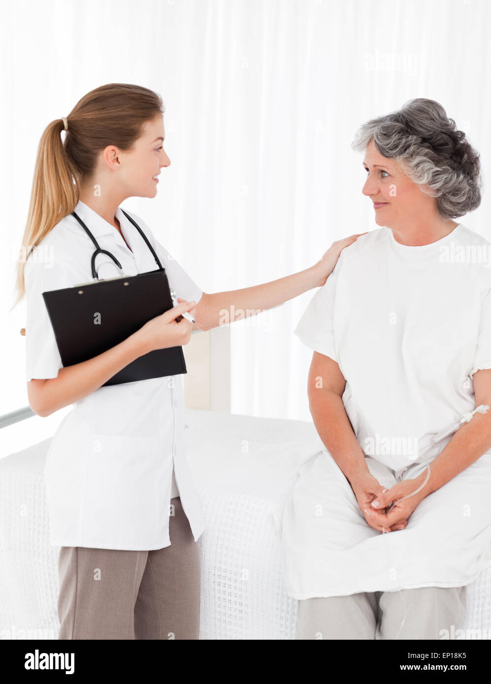 Nurse talking with her patient Stock Photo - Alamy