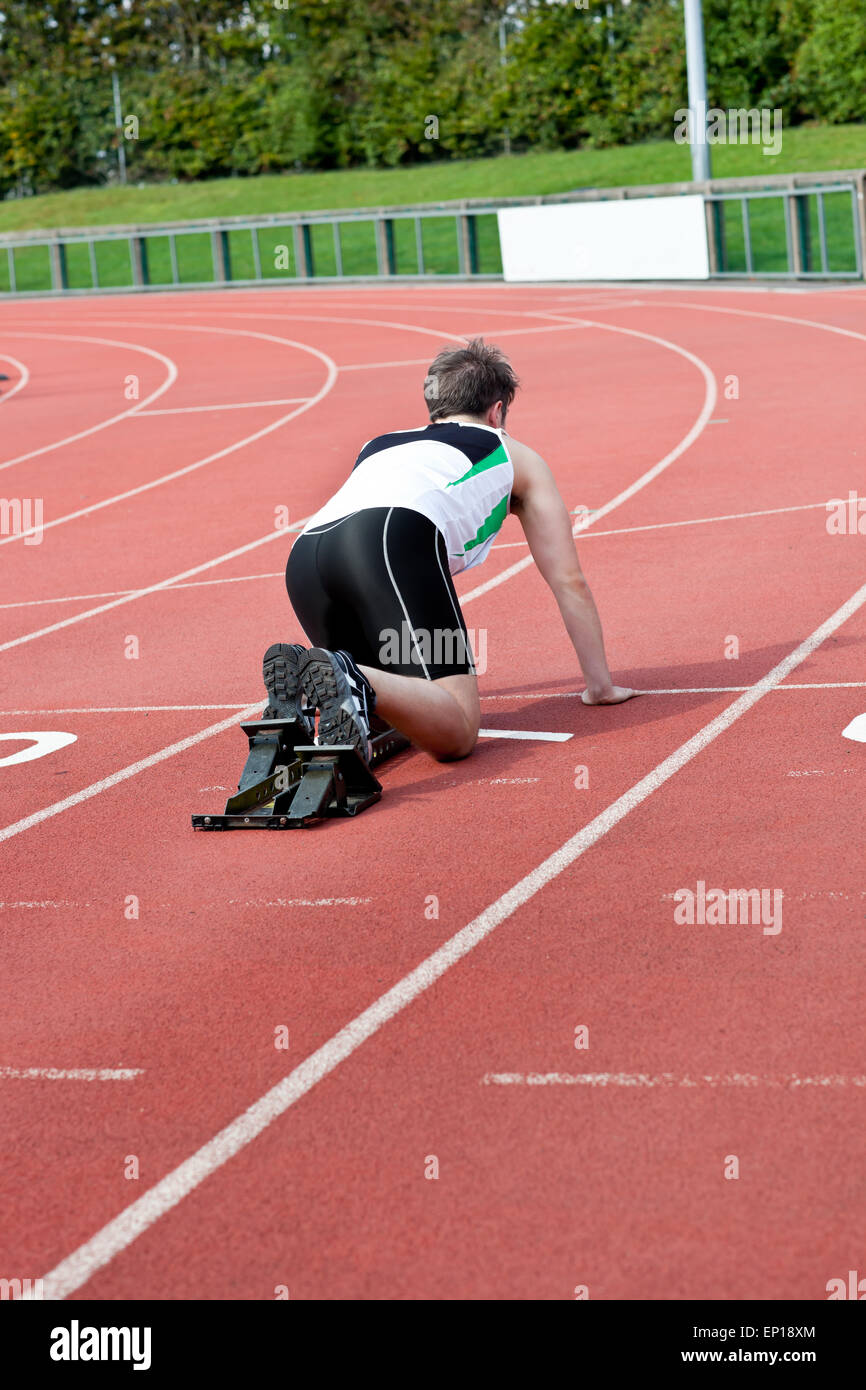Runner crouching starting block hi-res stock photography and images - Alamy