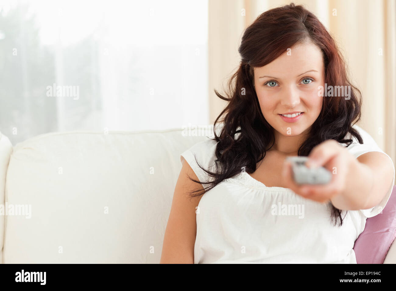Close up of a woman watching TV Stock Photo - Alamy