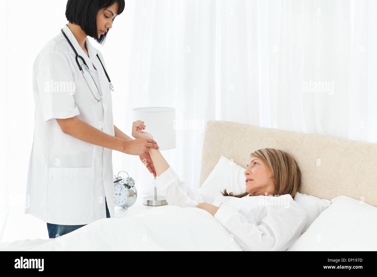 Nurse taking the pulse hi-res stock photography and images - Alamy