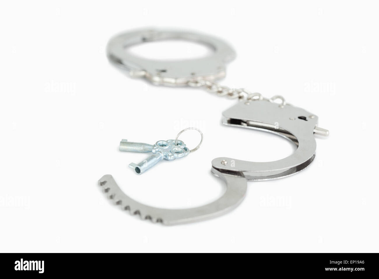 Close up of handcuffs and keys Stock Photo - Alamy